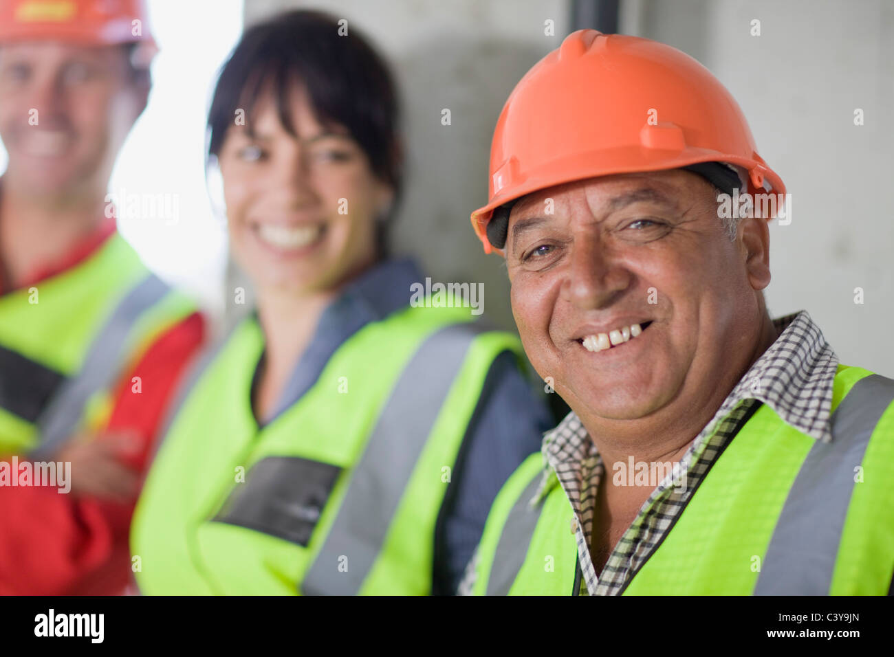 Group of smiling workers Stock Photo - Alamy