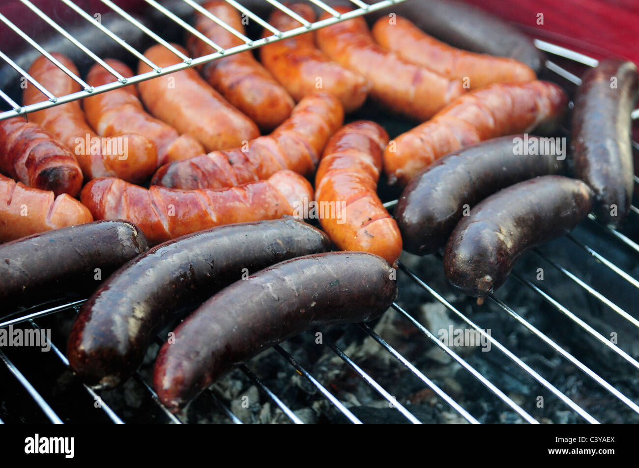 Preparation of meat on grill Stock Photo - Alamy