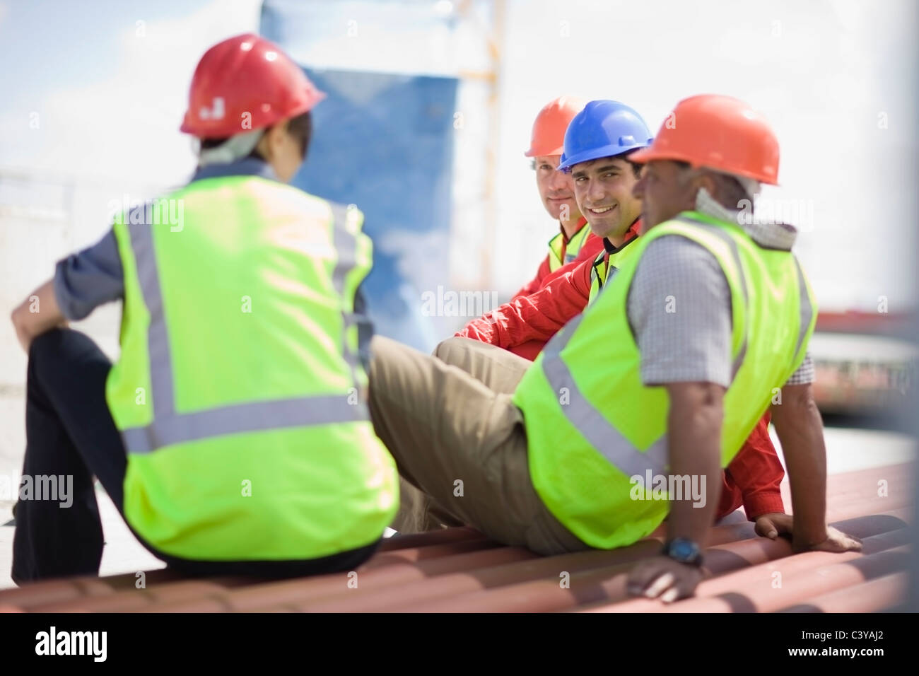 Building workers having a rest Stock Photo - Alamy