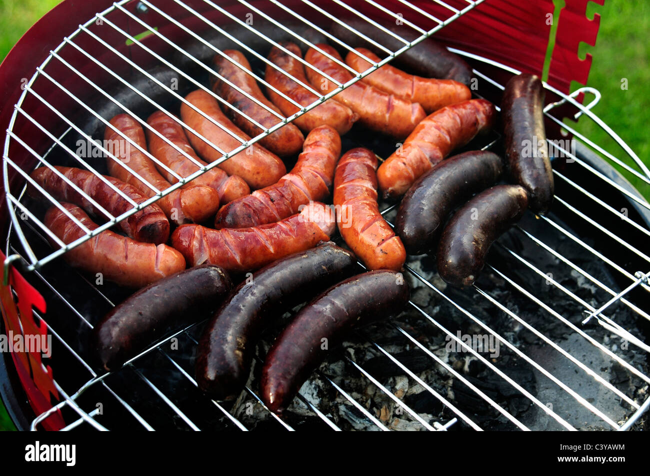 Preparation of meat on grill Stock Photo - Alamy