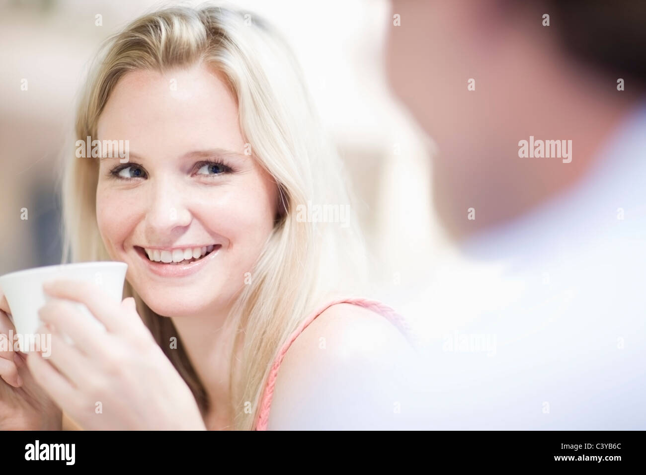 Woman having some coffee Stock Photo - Alamy