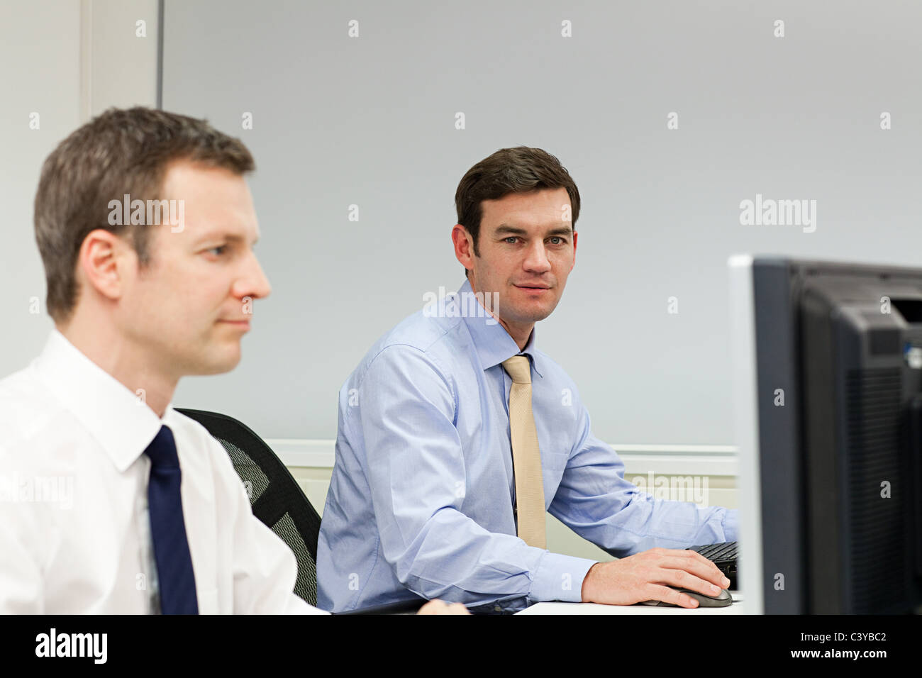 Businessmen in office Stock Photo - Alamy