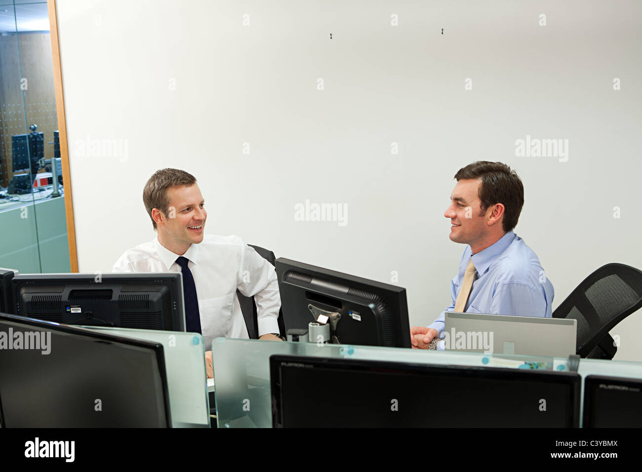 Businessmen in office Stock Photo - Alamy