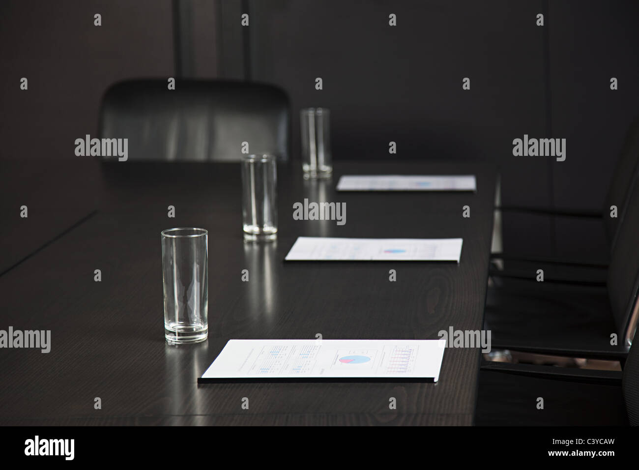 Conference table with drinking glasses and documents Stock Photo - Alamy
