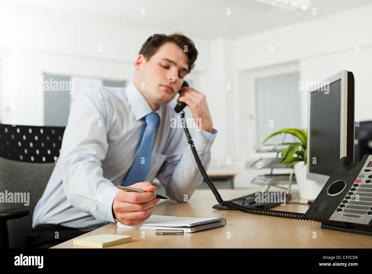 Office worker on telephone call Stock Photo - Alamy