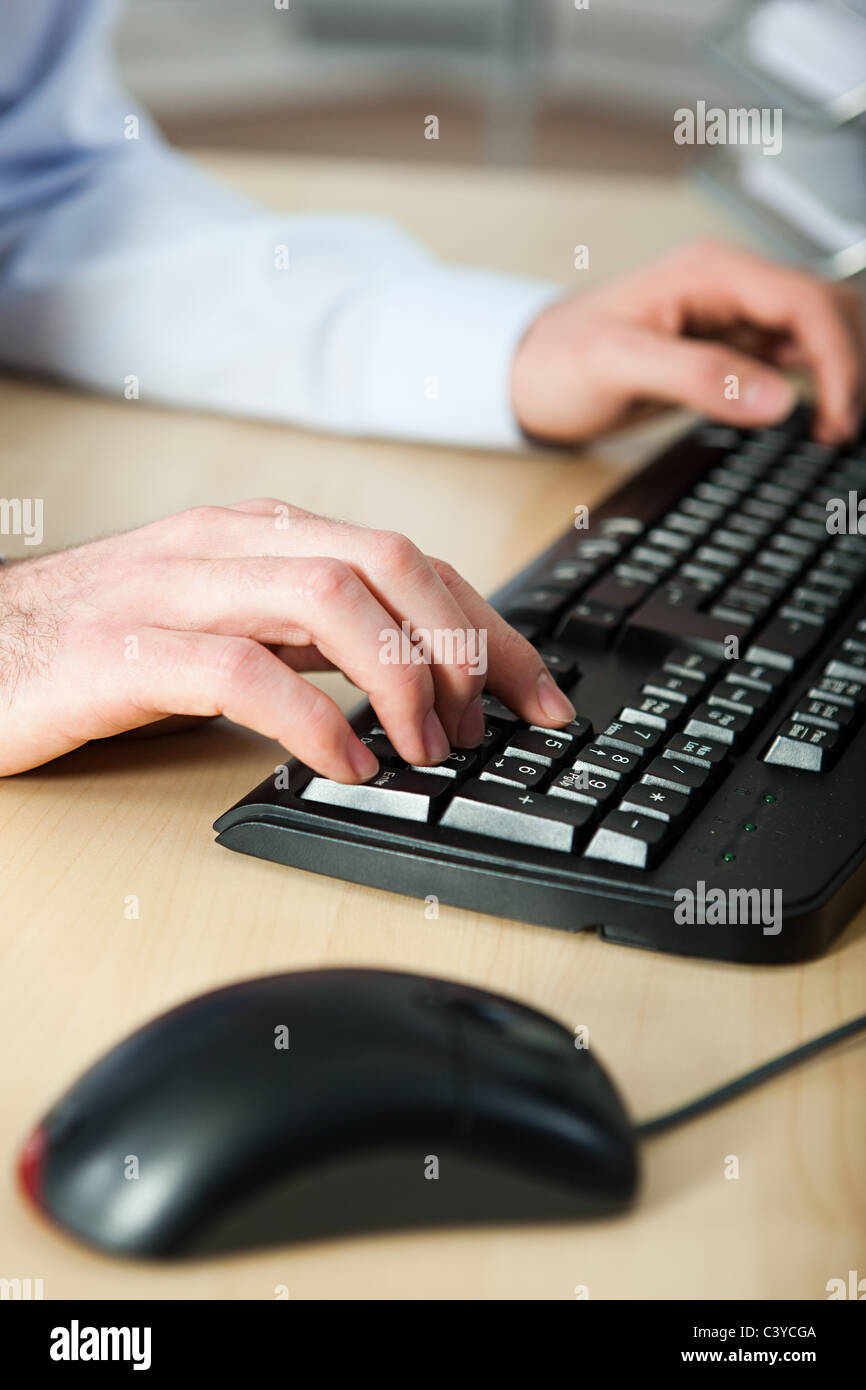 Office worker using computer Stock Photo - Alamy
