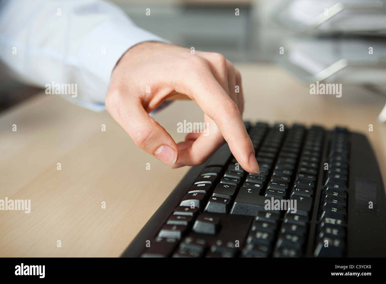 Office worker using computer Stock Photo - Alamy