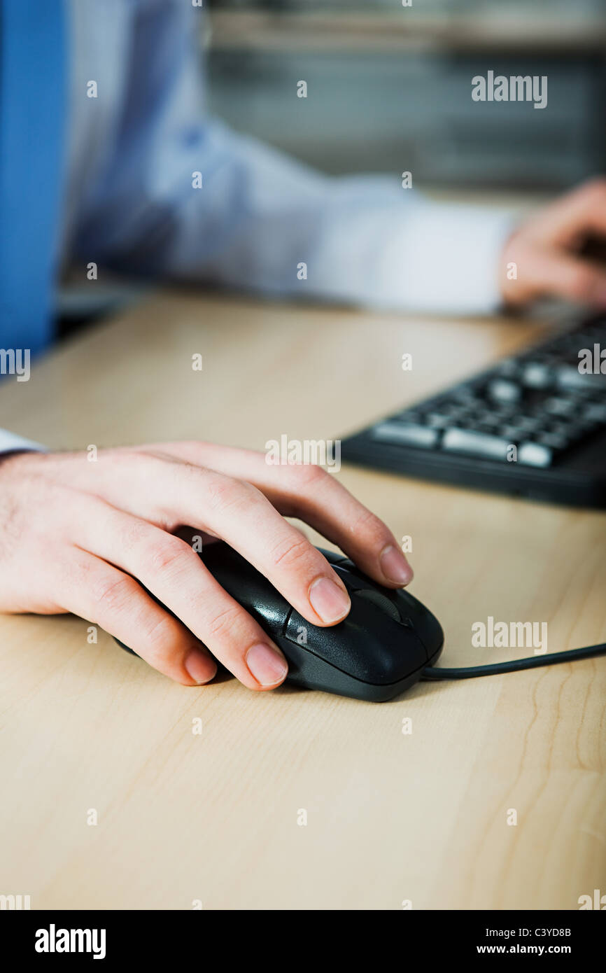 Office worker using computer Stock Photo - Alamy