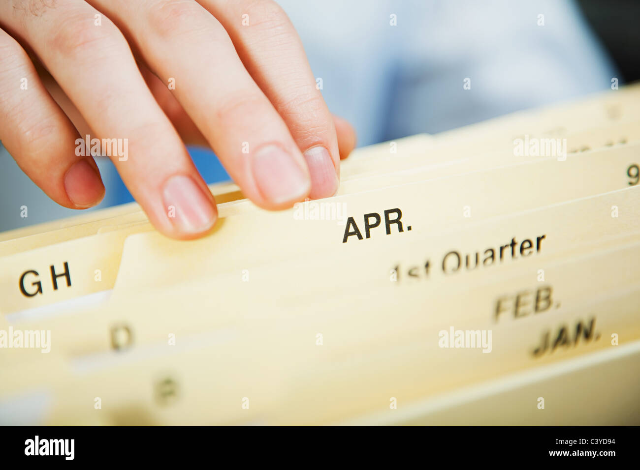 Office worker filing document Stock Photo - Alamy
