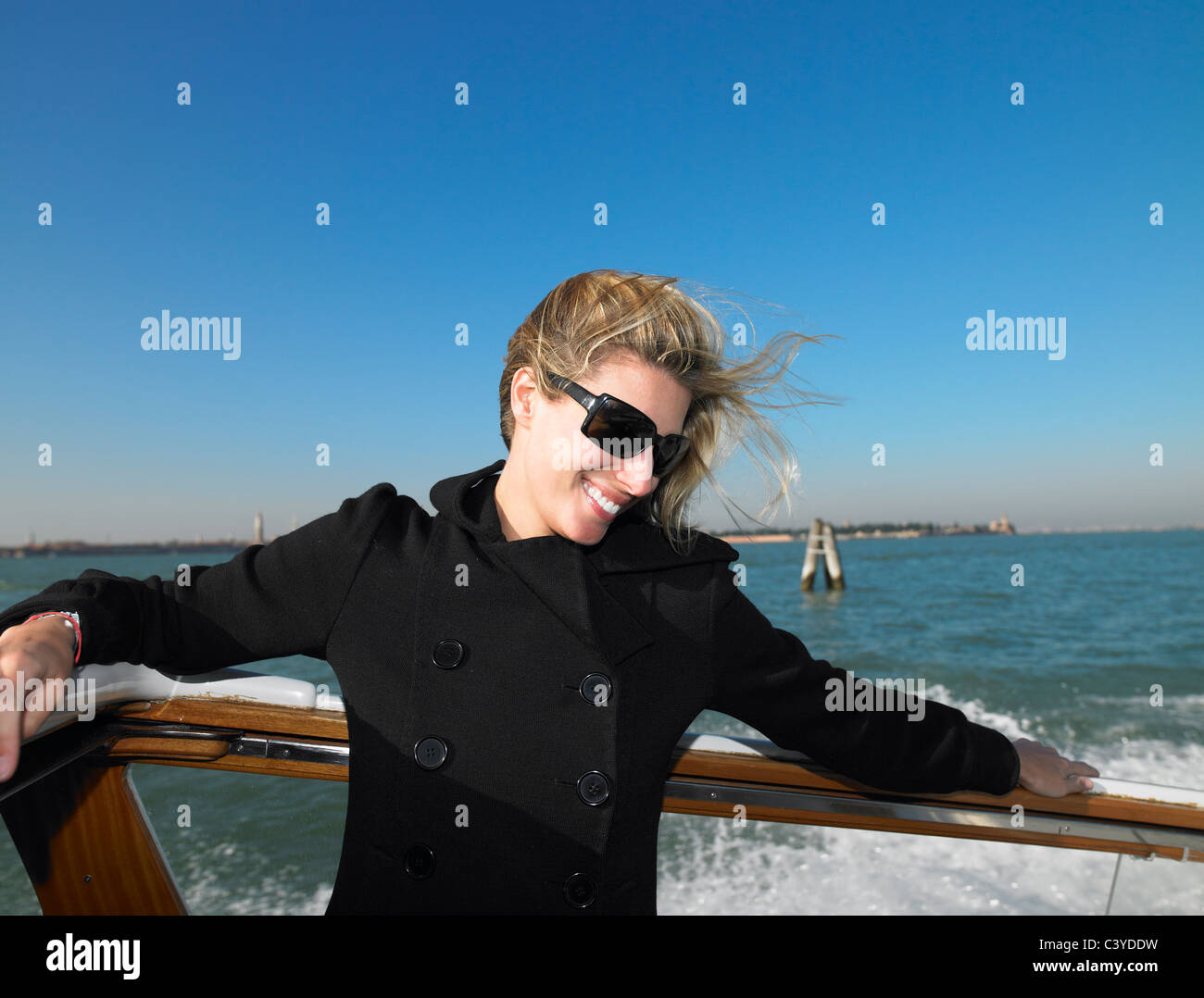 Woman enjoying the boat ride Stock Photo - Alamy