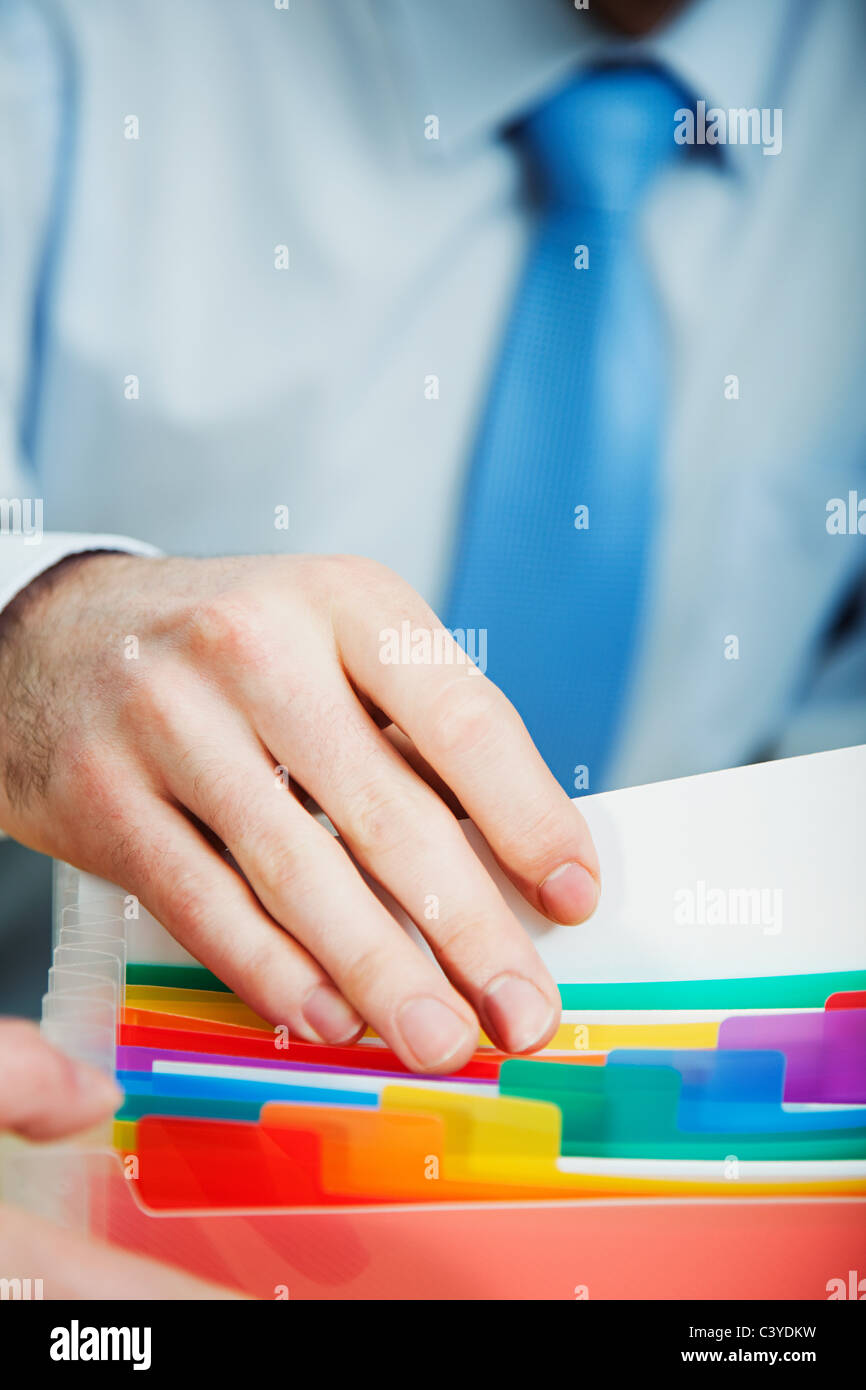Office worker filing document Stock Photo - Alamy
