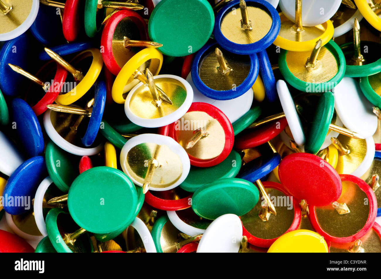 Many colourful office pins on the background Stock Photo - Alamy