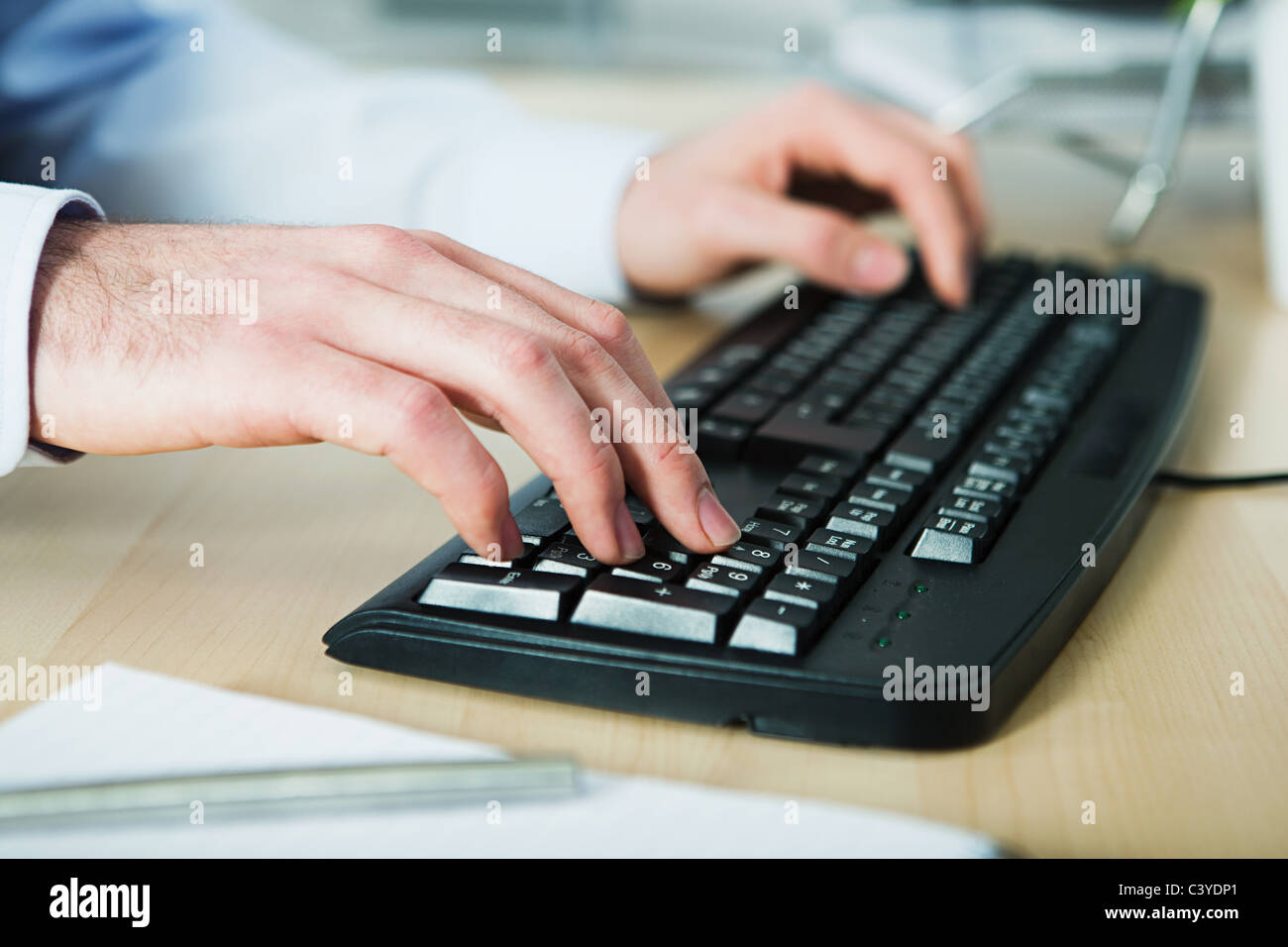 Office worker using computer Stock Photo - Alamy