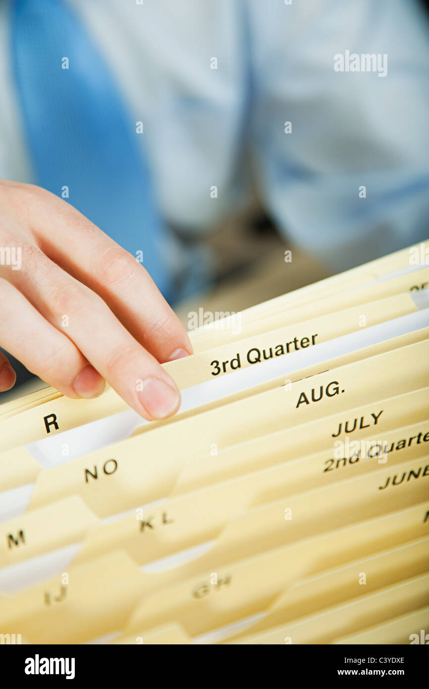 Office worker filing document Stock Photo - Alamy