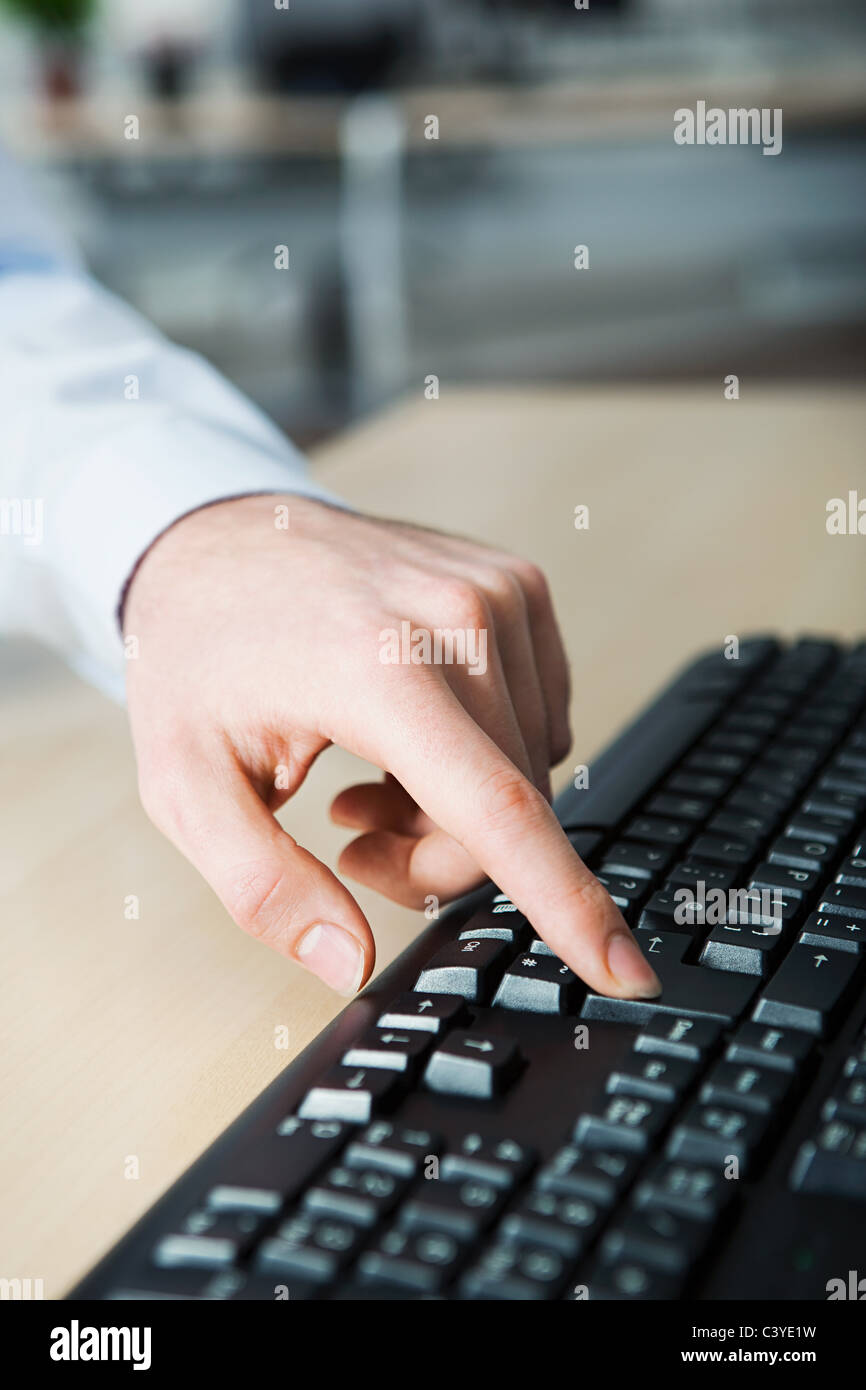Office worker using computer Stock Photo - Alamy