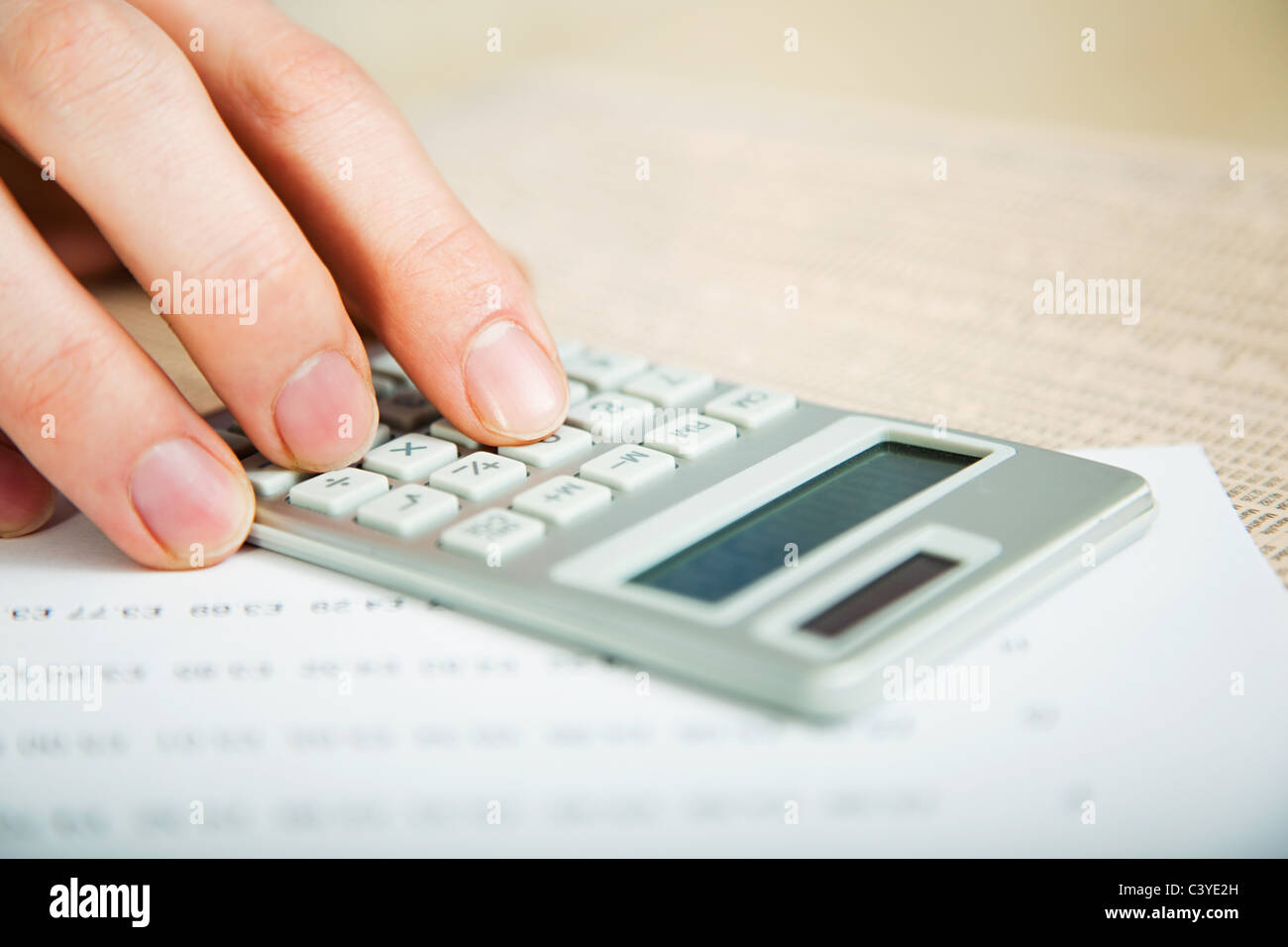 Office worker using calculator Stock Photo - Alamy
