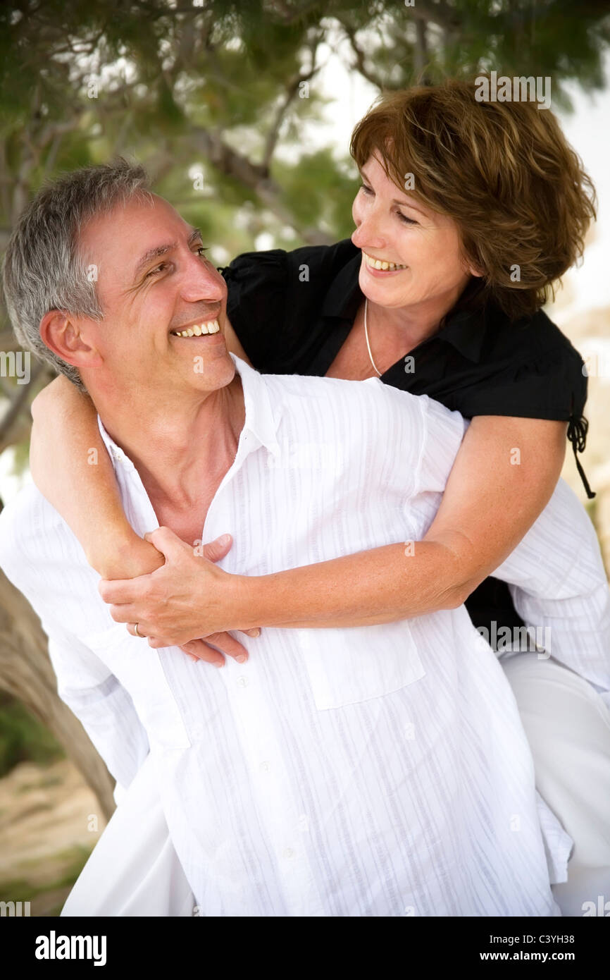 Mature couple smiling and having fun Stock Photo - Alamy
