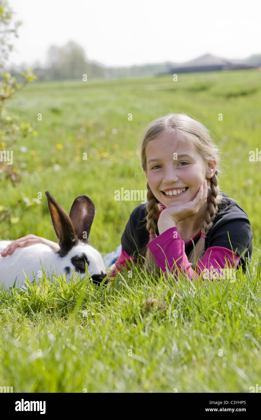 Child petting pet rabbit hi-res stock photography and images - Alamy