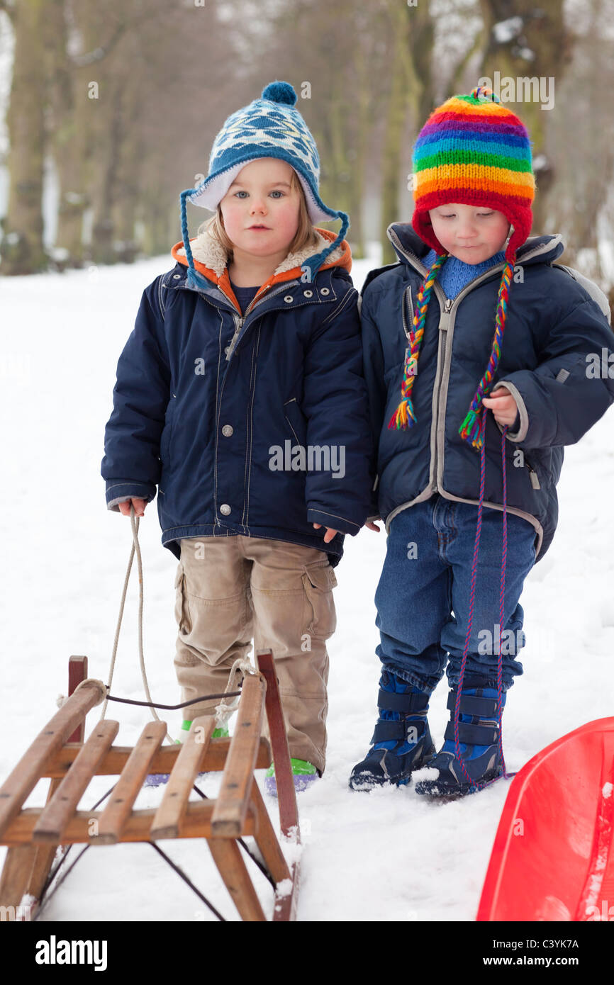 Two little boys in the snow Stock Photo - Alamy