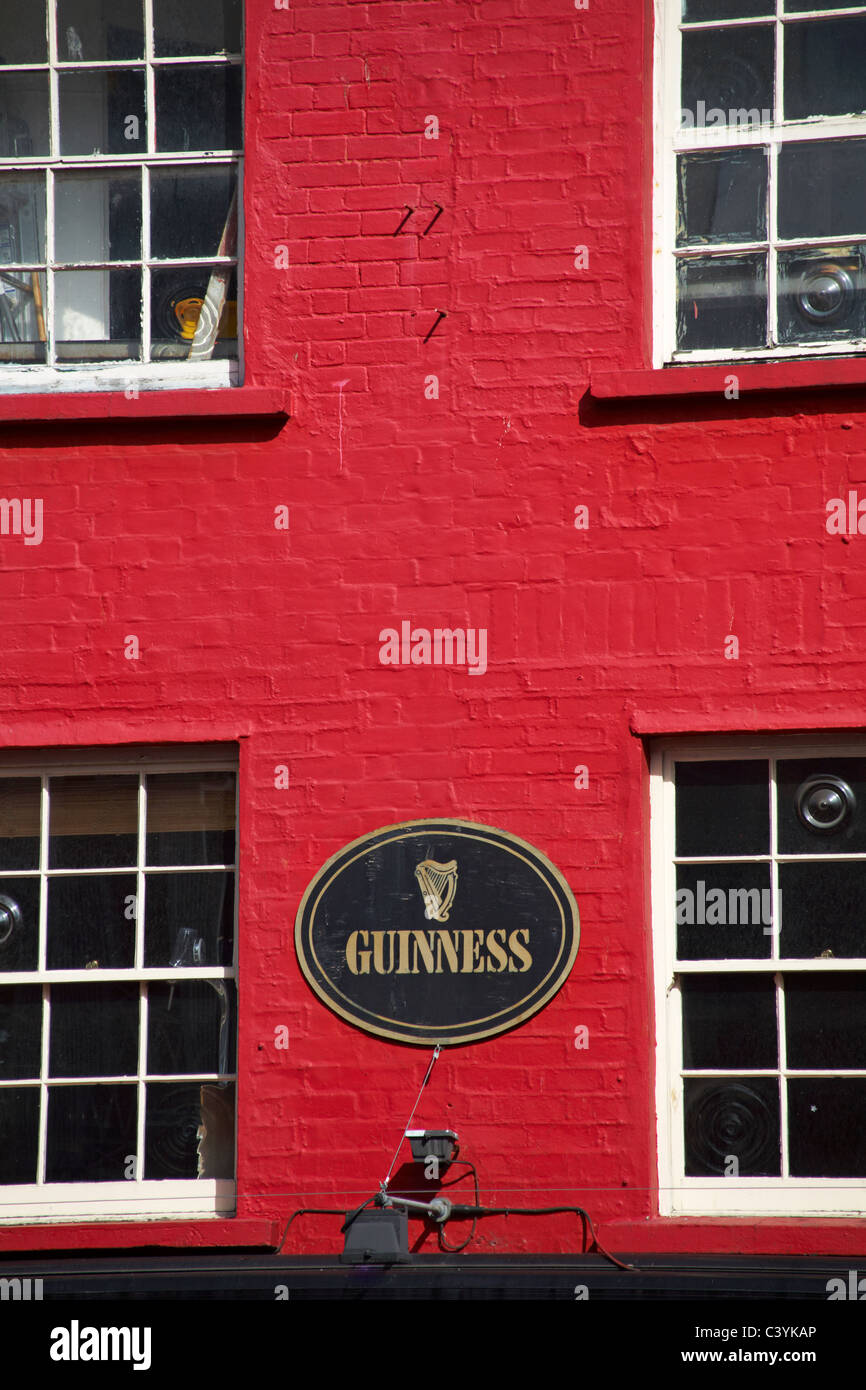 Guinness sign on red bricked building in Brighton in May Stock Photo ...