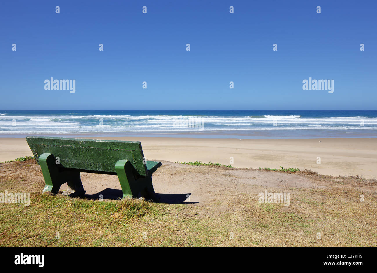 Empty bench overlooking the beach and ocean at Hartenbos holiday resort ...