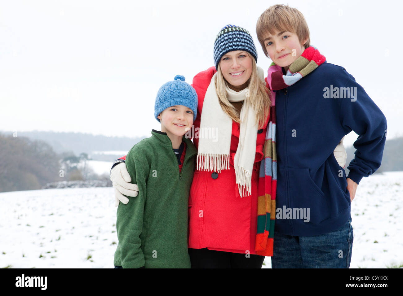 A mother and her sons in the snow Stock Photo - Alamy