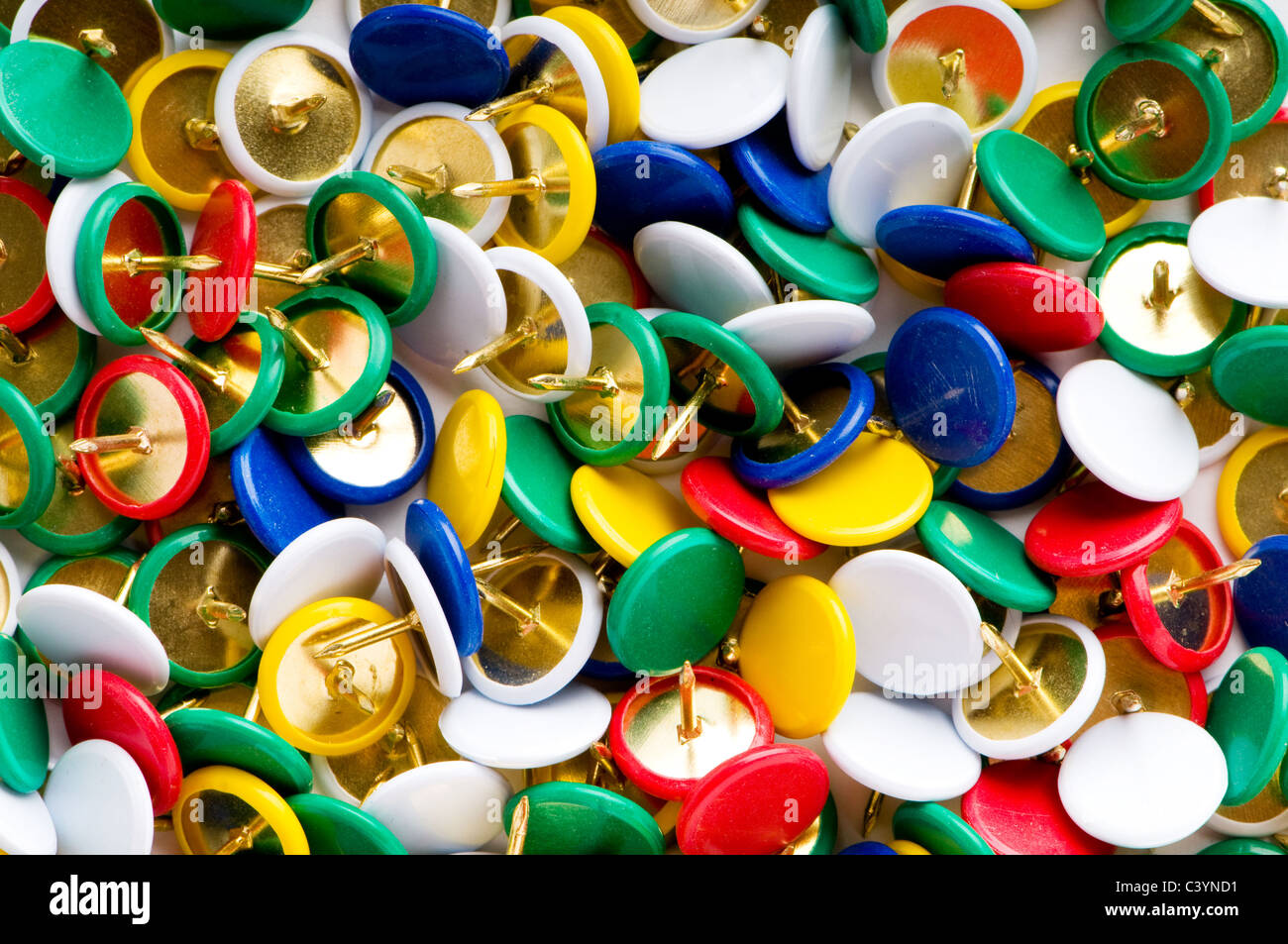 Many colourful office pins on the background Stock Photo - Alamy