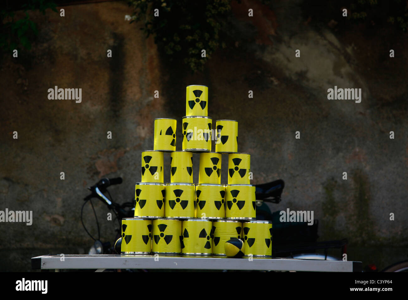 Pile of cans bearing the Ionizing radiation hazard symbol at an Anti ...