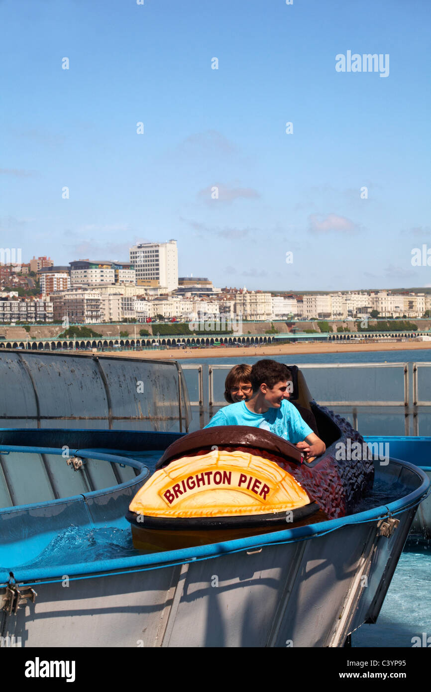Having fun on the water rides on Brighton Pier in May Stock Photo - Alamy