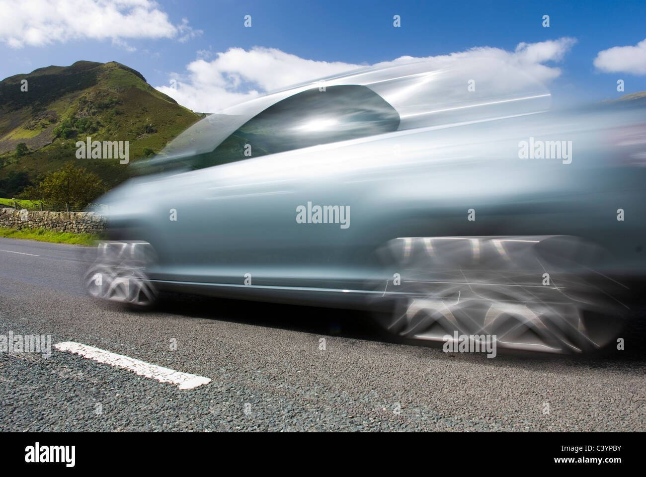 Blurred car on the mountain road, Lake District National Park, Cumbria ...