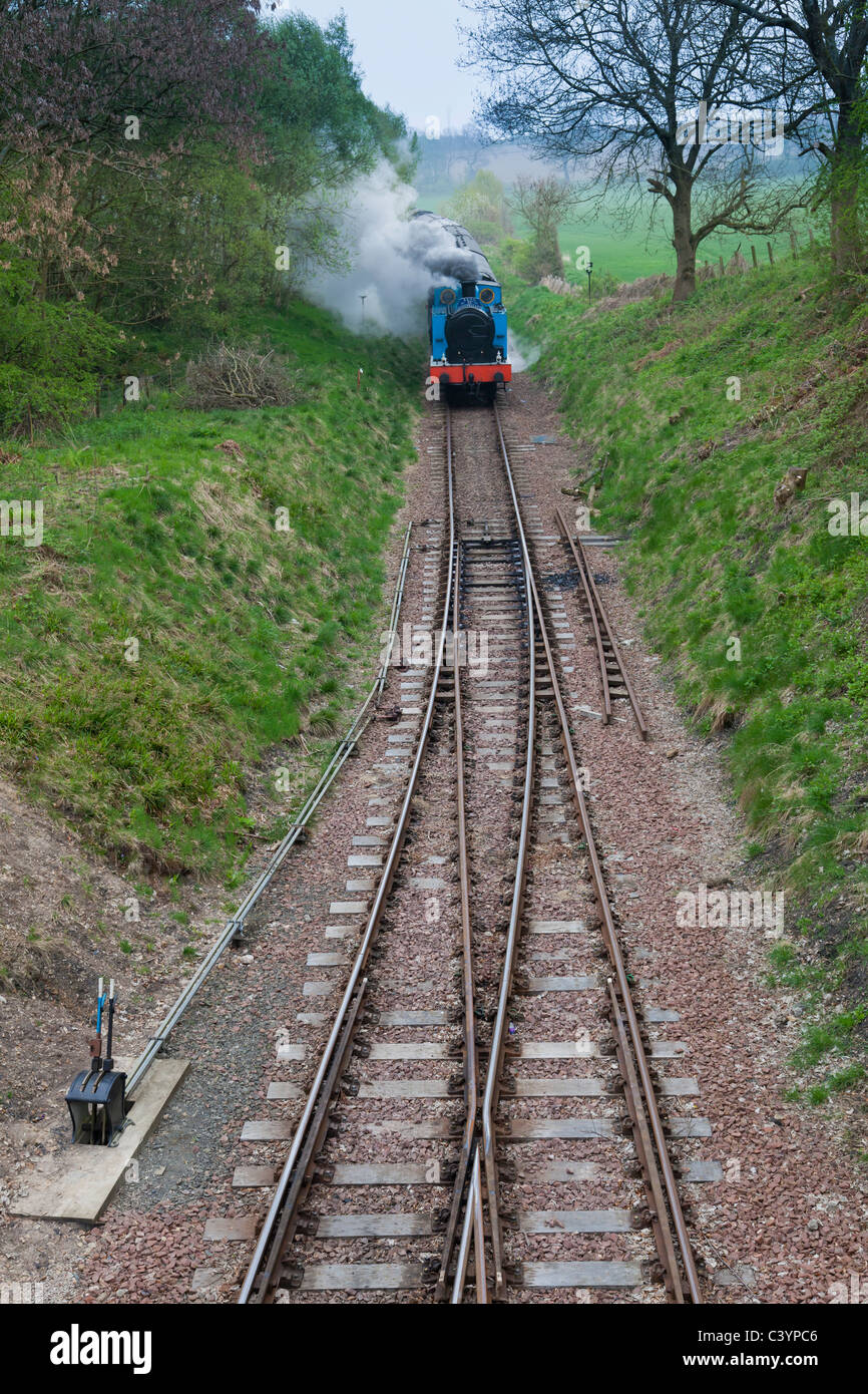 Steam train approaches points Stock Photo - Alamy