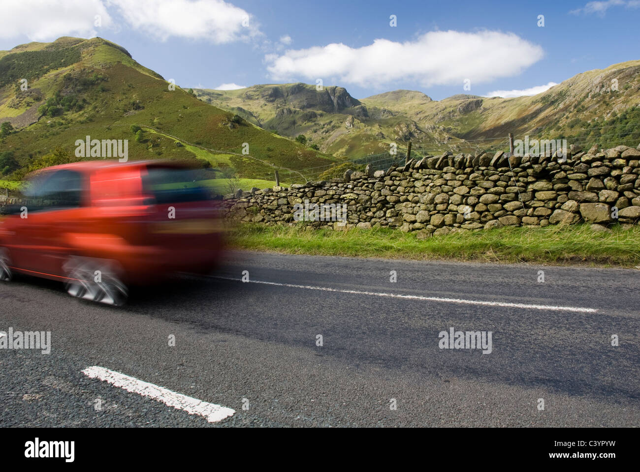 Speeding red car, Road A592, Lake District National Park, UK Stock ...