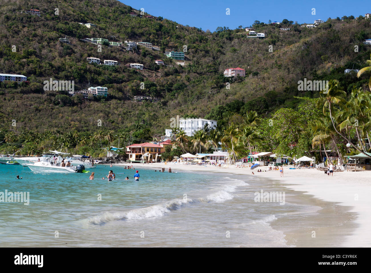 Happy scene of people playing in the water by a beach resort with ...