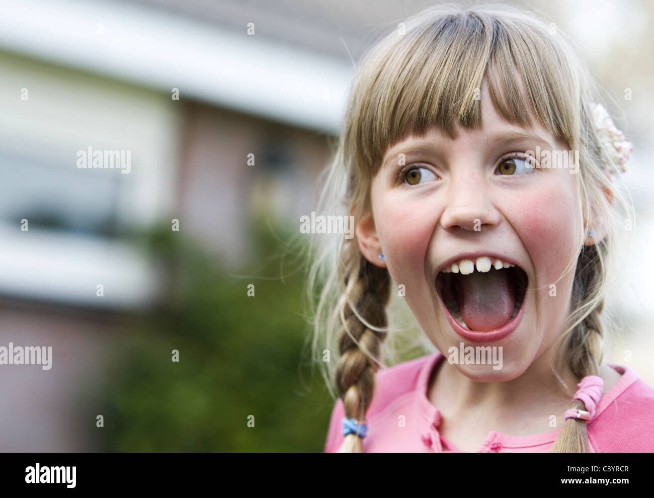 Excited young girl Stock Photo - Alamy