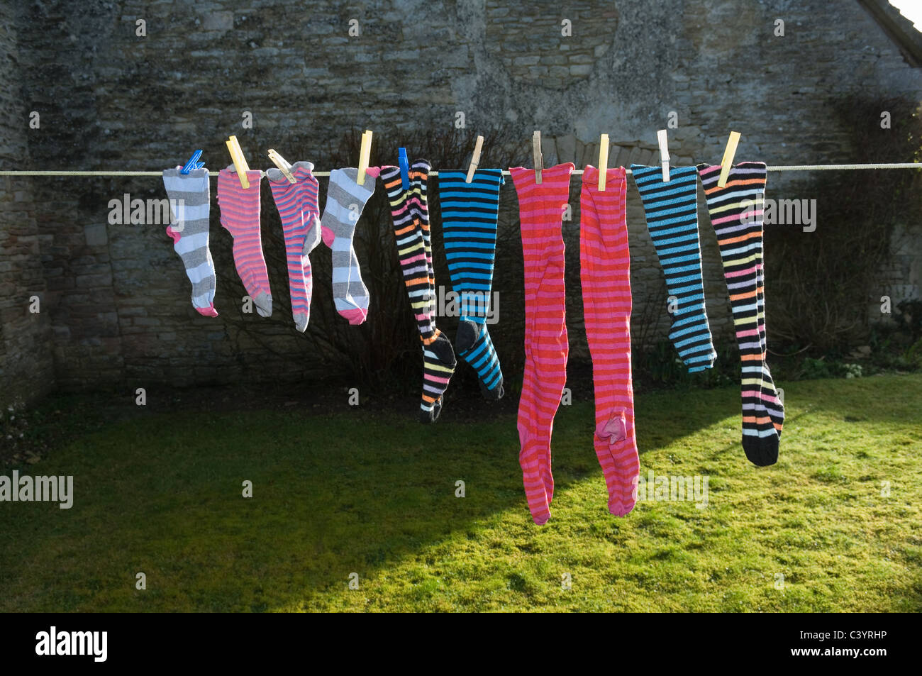 colourful socks on washing line Stock Photo - Alamy