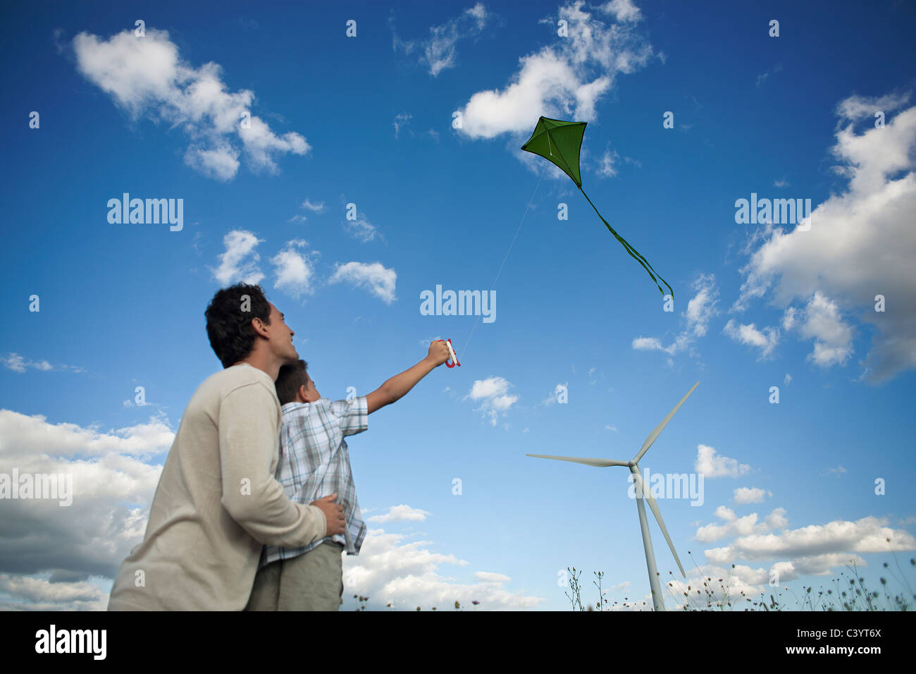Father and son flying a kite Stock Photo - Alamy