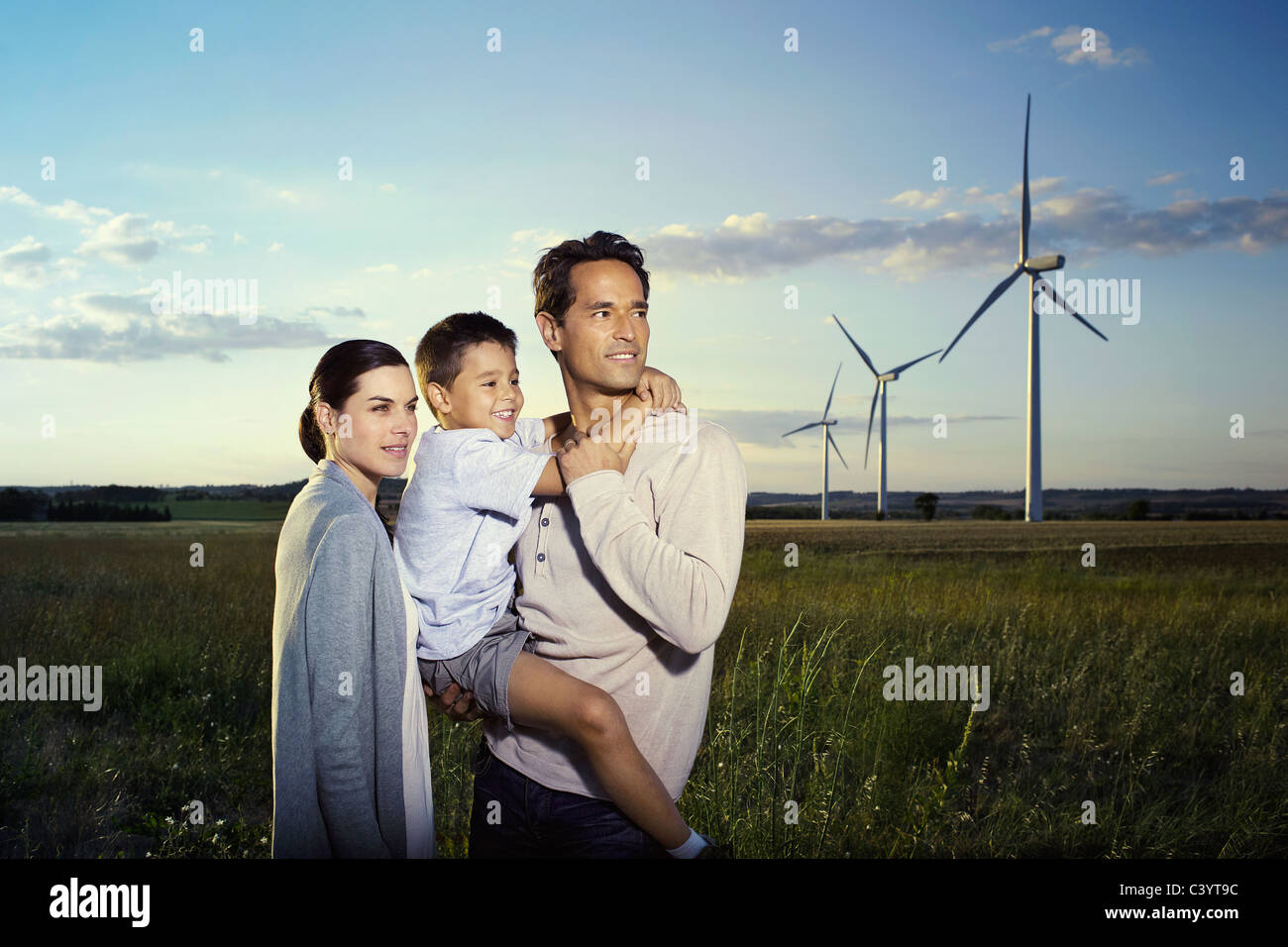 Family on a windfarm Stock Photo - Alamy