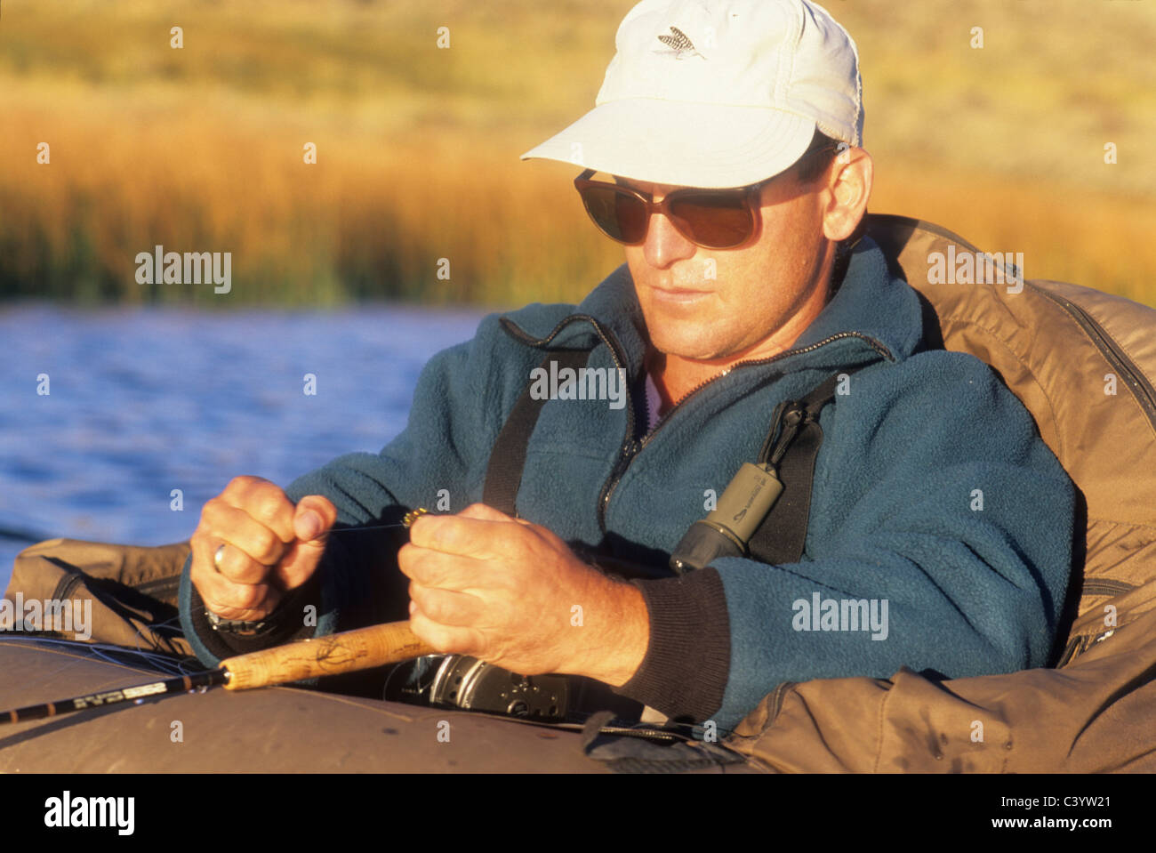 Man fly fishing Stock Photo - Alamy