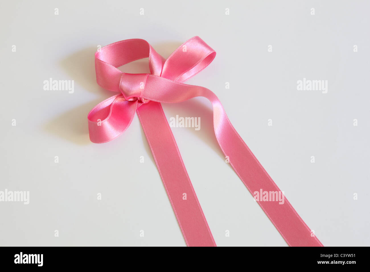 Pink satin ribbon Stock Photo - Alamy
