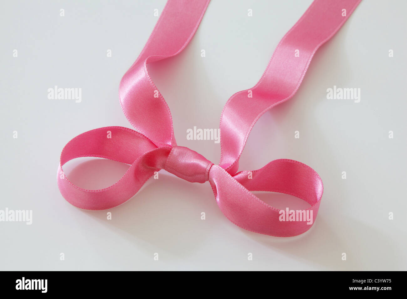 Pink satin ribbon Stock Photo - Alamy