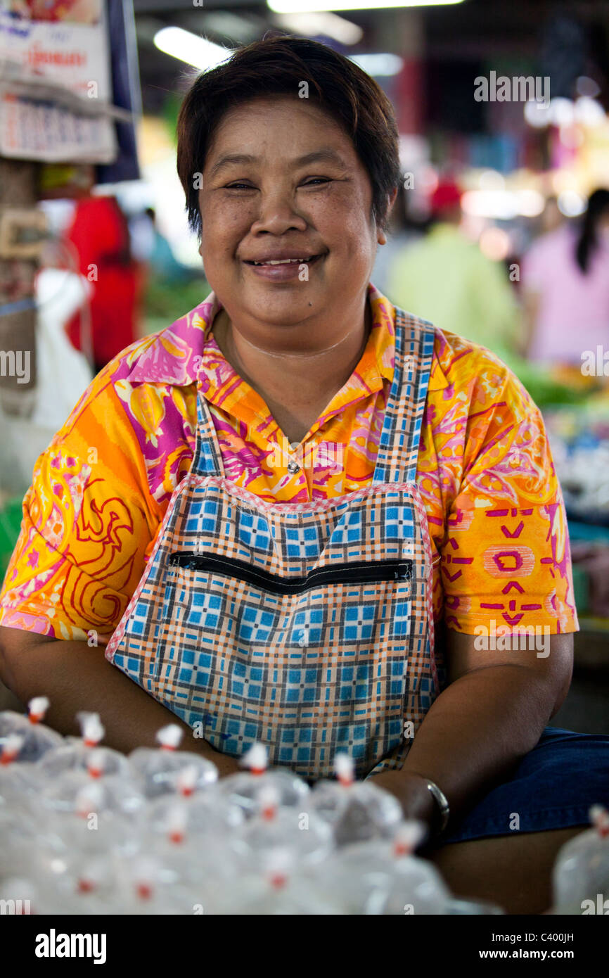 Food shopkeeper smile with her goods in local market Lampang, Thailand ...