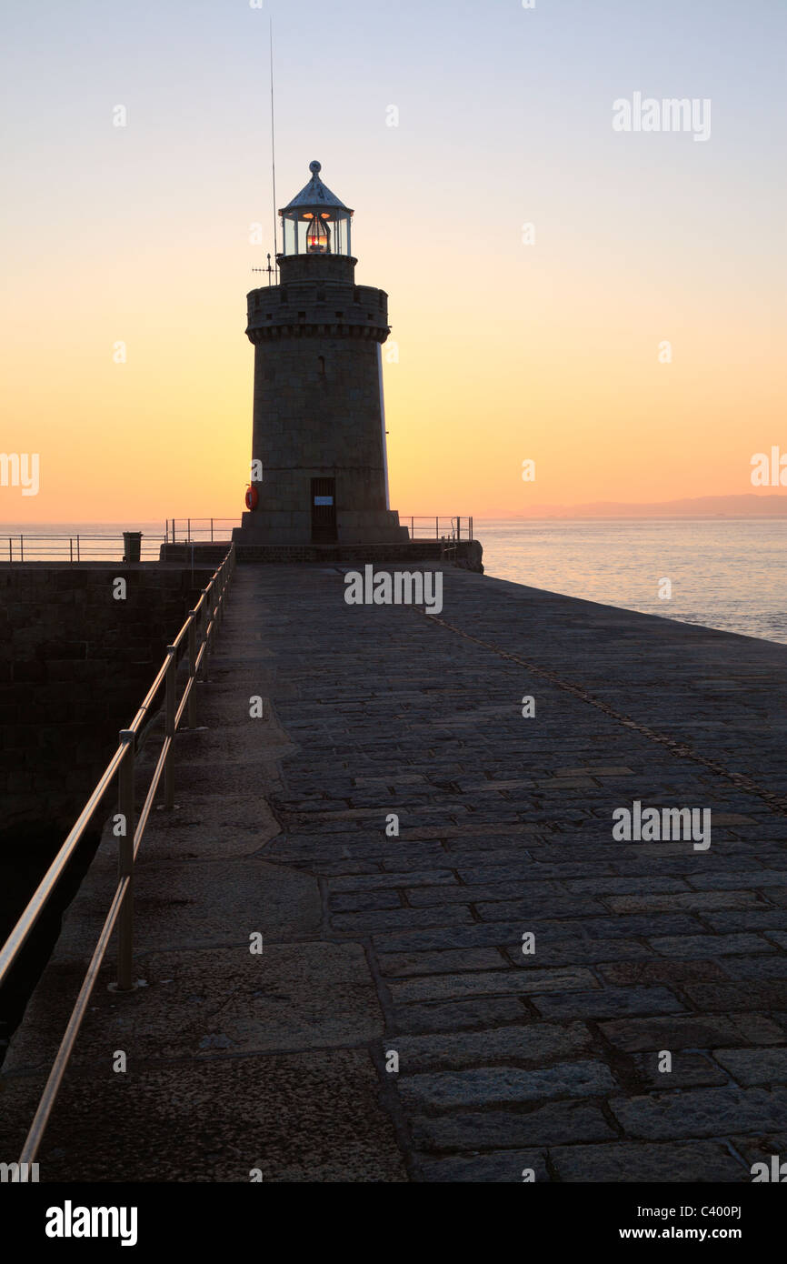 St Peters Port lighthouse at sunrise Stock Photo - Alamy