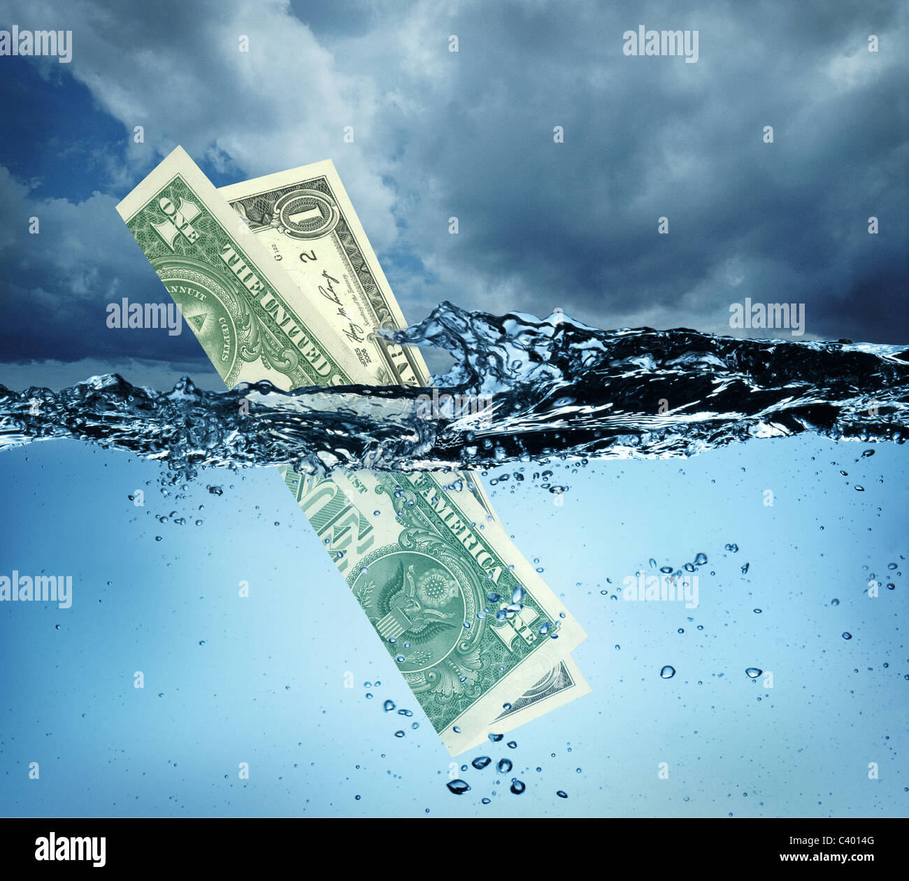 A sinking dollar bill Stock Photo - Alamy