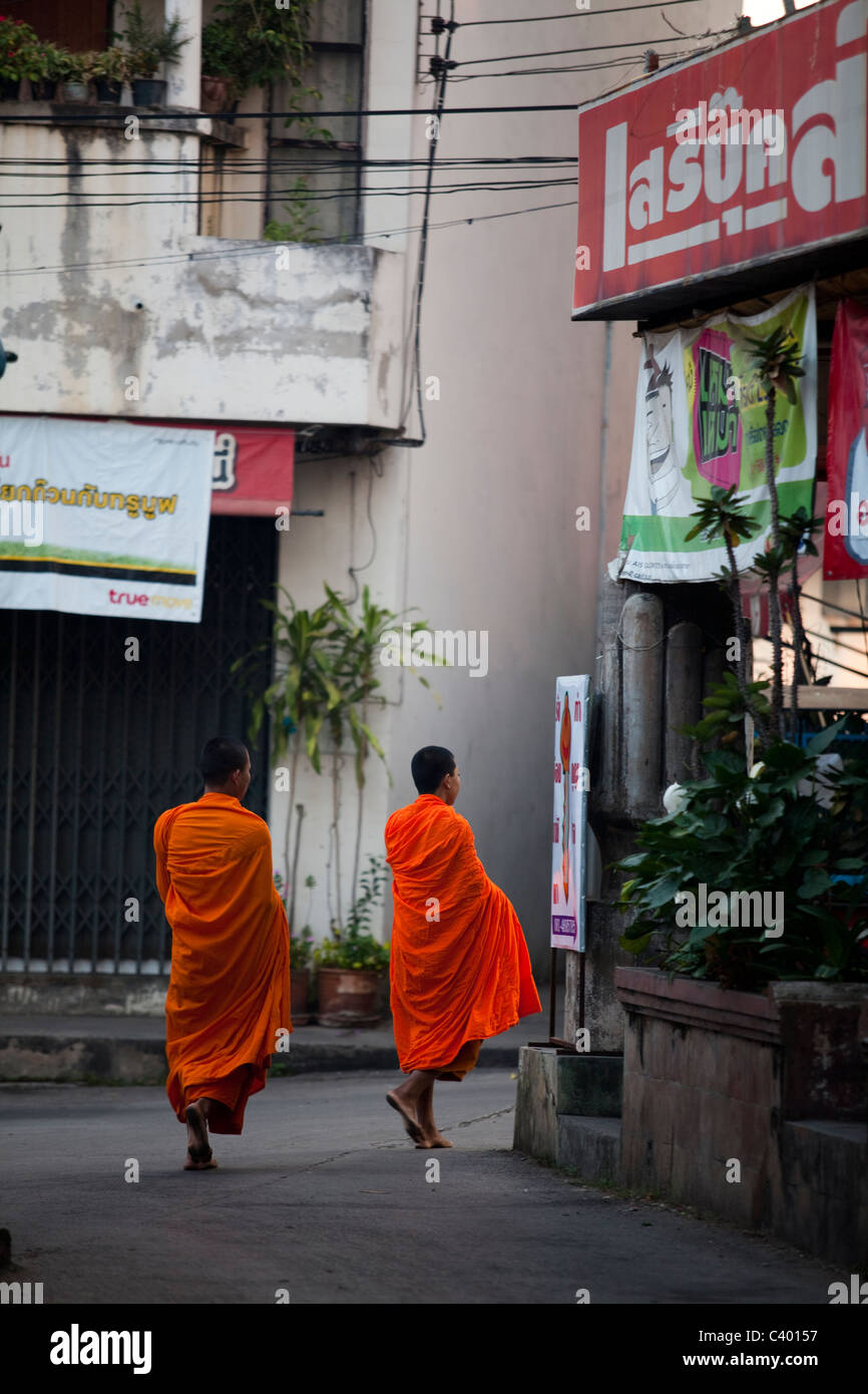 Two young monks religious mendicancy to downtown city in Lampang ...