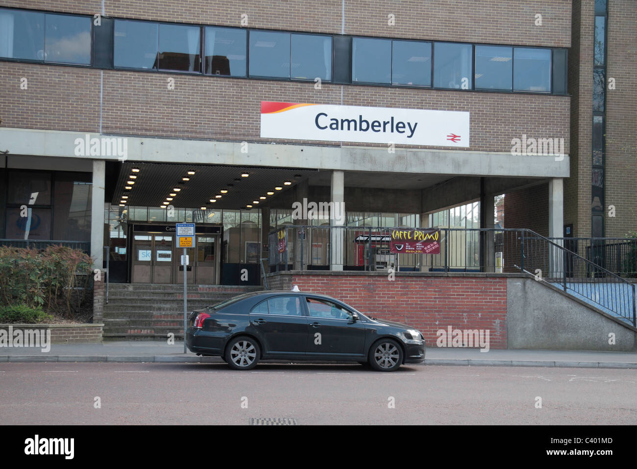 A private taxi parked outside the main entrance to Camberley mainline ...
