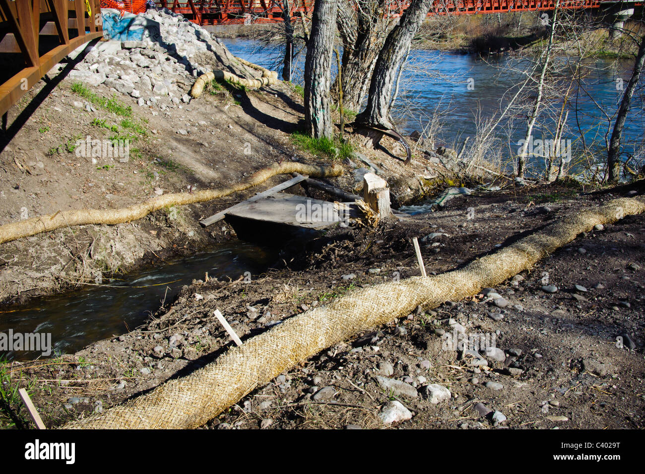 Coconut coir has been placed at the edge of a stream to revegetate the ...