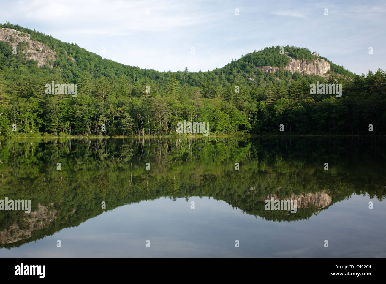 Reflection of cliff in Echo Lake from Echo Lake State Park in North ...