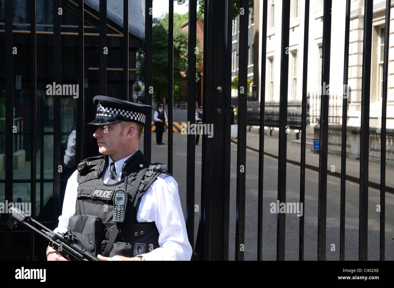 Armed Policeman on guard outside Downing Street on the day of President ...