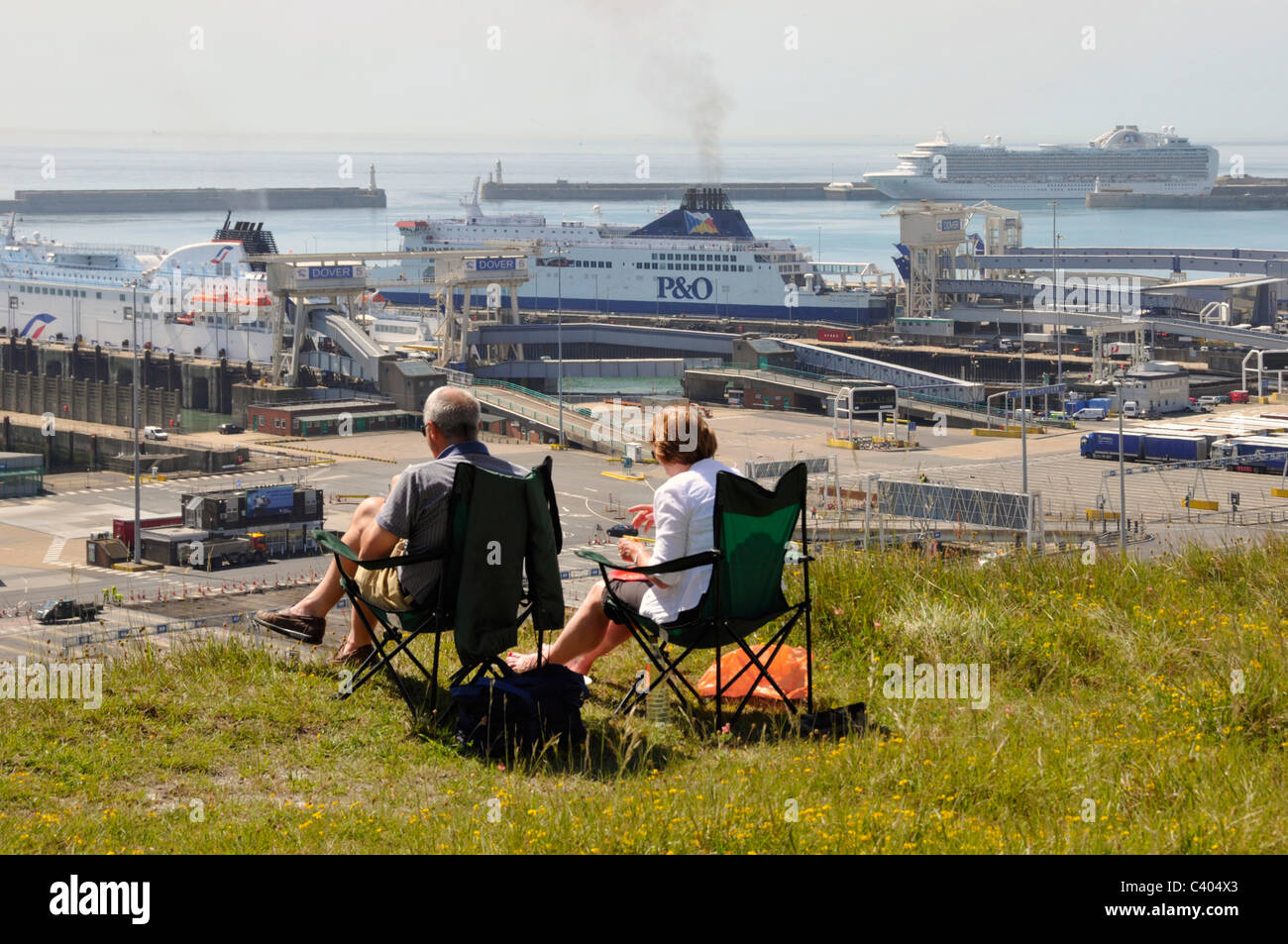Couple viewing Ferry Terminal activities from top of White Cliffs of ...