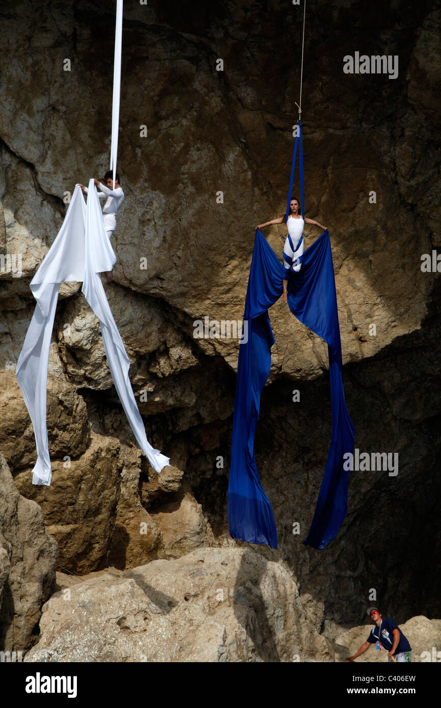 Aerobatic dancing at Red Bull cliff diving in Lake Vouliagmeni in ...